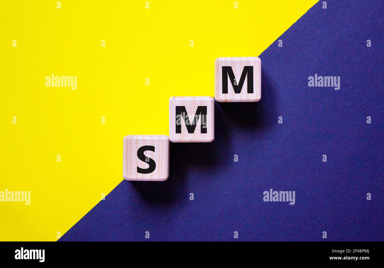 SMM, social media marketing symbol. Wooden cubes with word 'SMM ...