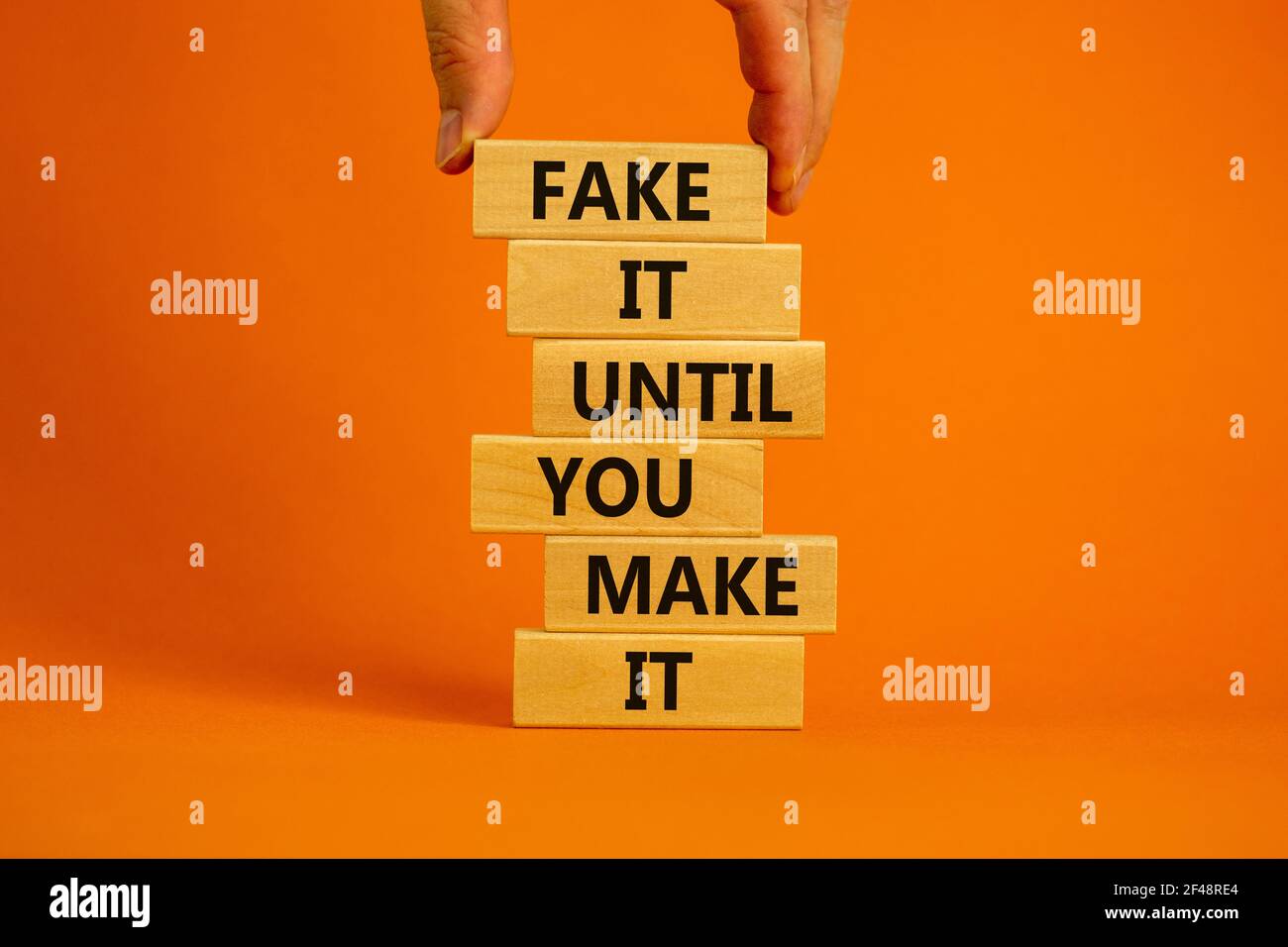 Fake it until you make it symbol. Wooden blocks with words 'Fake it ...