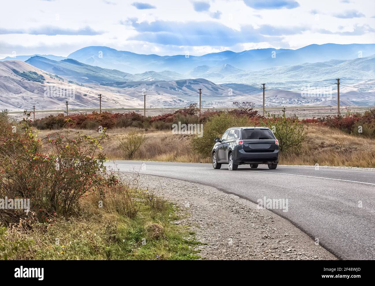 Crossover Rides the Highway in a Beautiful Mountainous Area Stock Photo ...