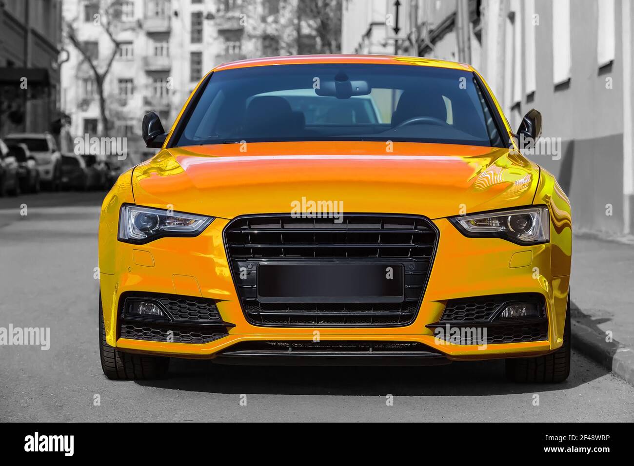 yellow luxury car parked on city street Stock Photo - Alamy
