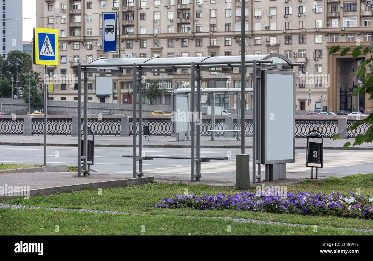 Bus stop with advertising banners in the city center Stock Photo - Alamy