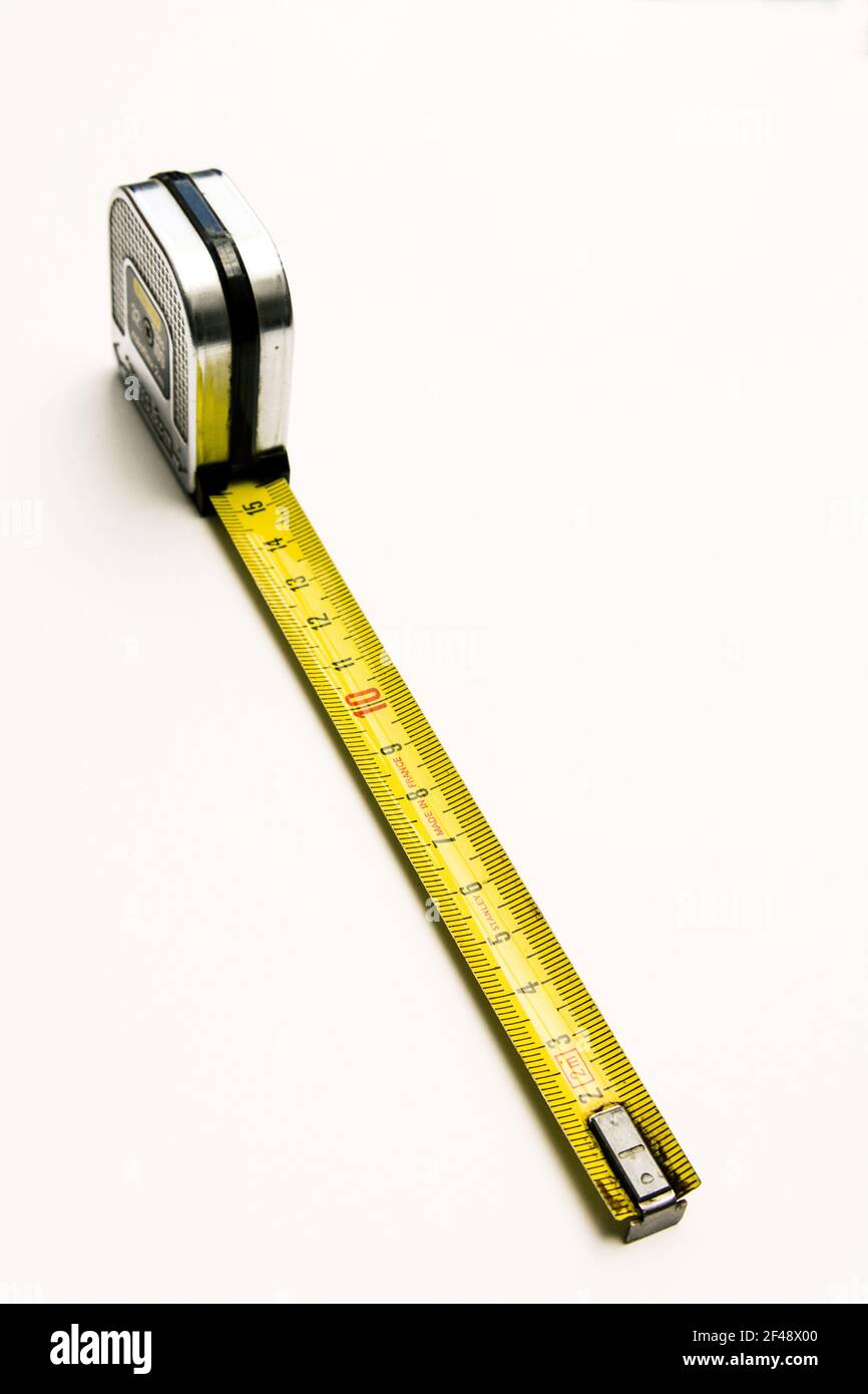 A vertical shot of a tape measure isolated on white background Stock ...