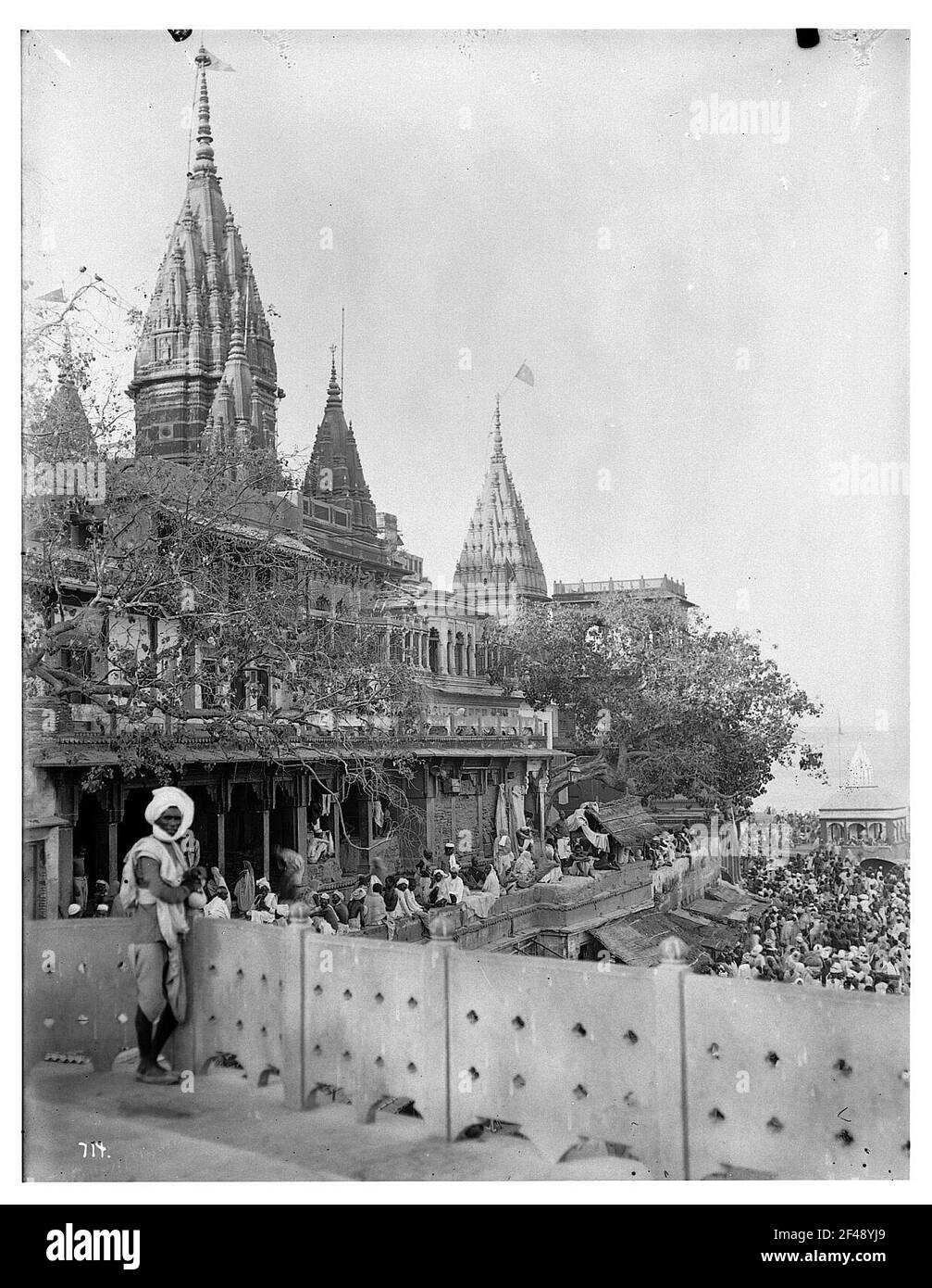 Varanasi (Benares), India. Indian pilgrims on a terrace above the Ghats ...