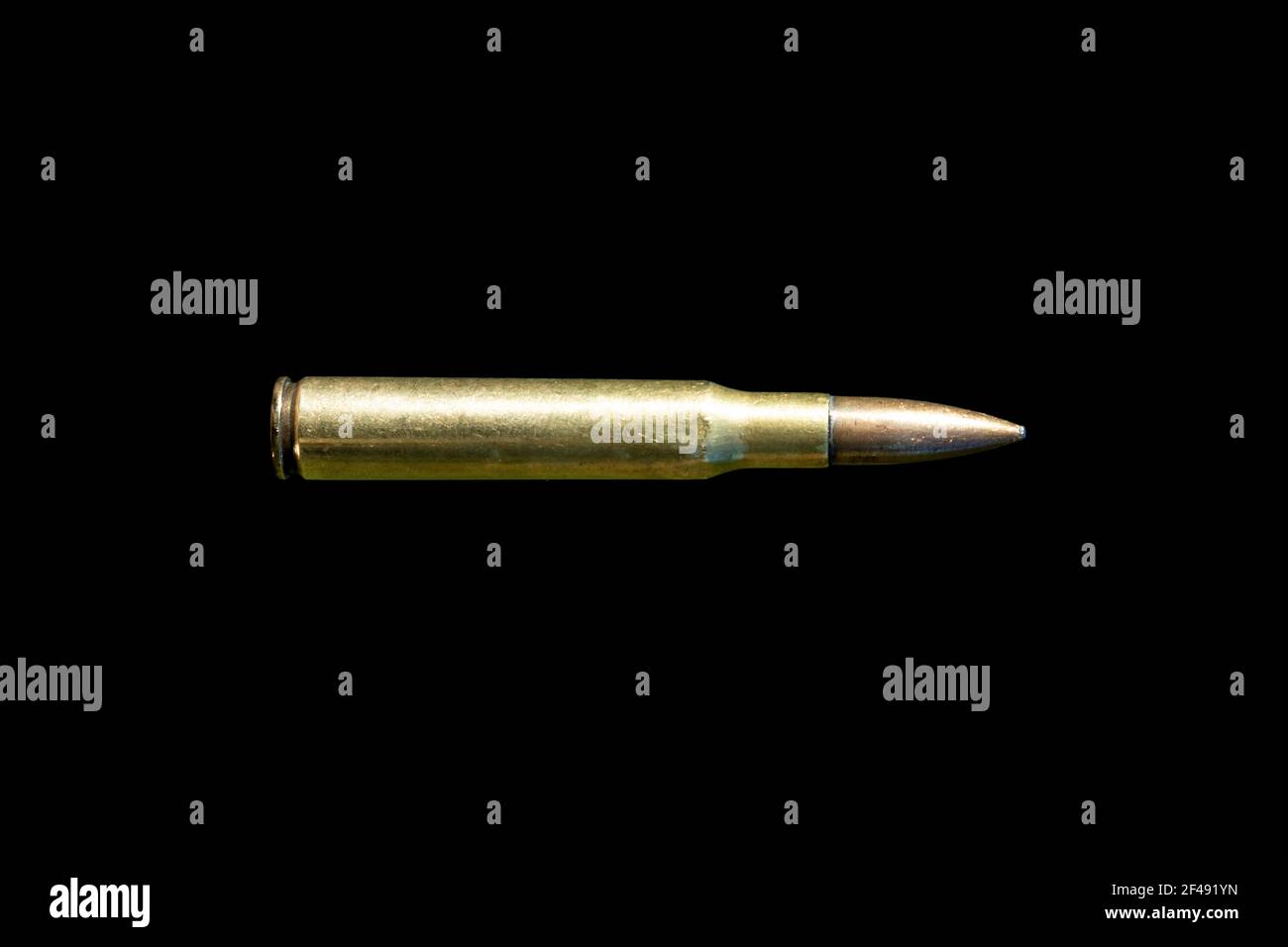 Rifle bullet long cartridge on black background Stock Photo - Alamy