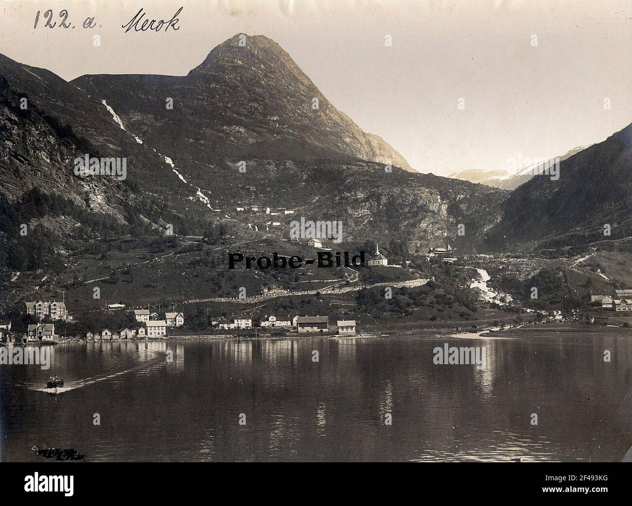 Merok. City with majestic mountains. View of the bay with houses from ...