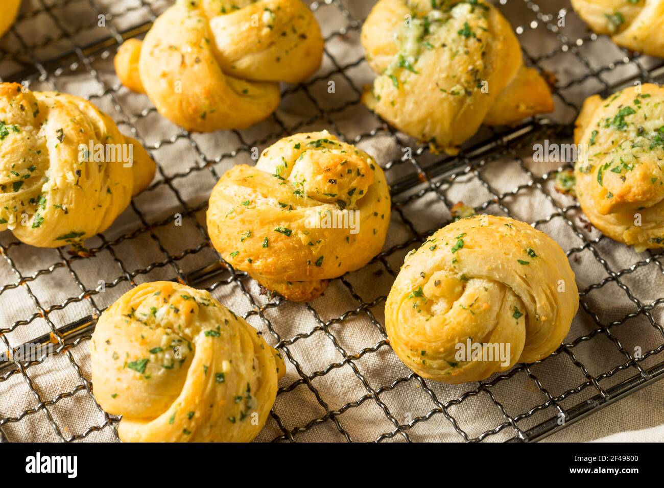 Homemade Buttery Garlic Knot Bread with Parsley Stock Photo - Alamy