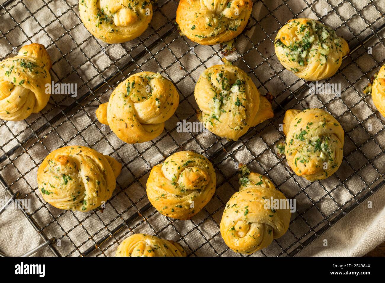 Homemade Buttery Garlic Knot Bread with Parsley Stock Photo - Alamy