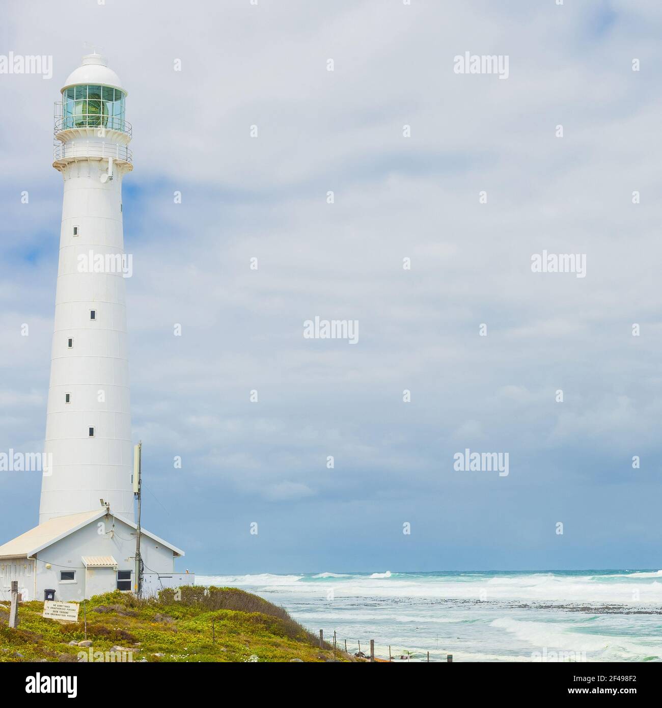 A vertical shot of a lighthouse on a cloudy day in Cape Town, South ...