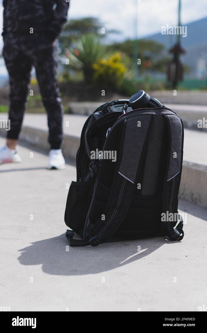 A sportsman's black backpack with clothes and accessories for doing ...