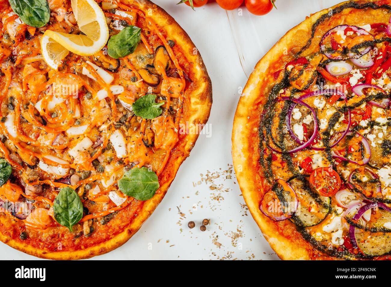 A top view of various tasty pizzas and spices Stock Photo - Alamy