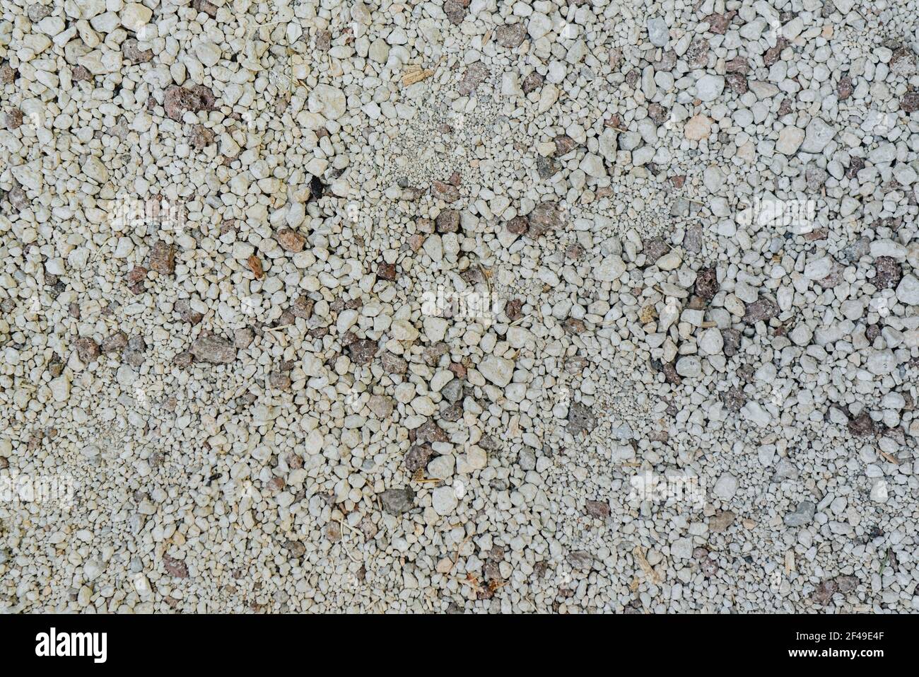A top view of sand and small rocks on the ground - great for wallpapers ...
