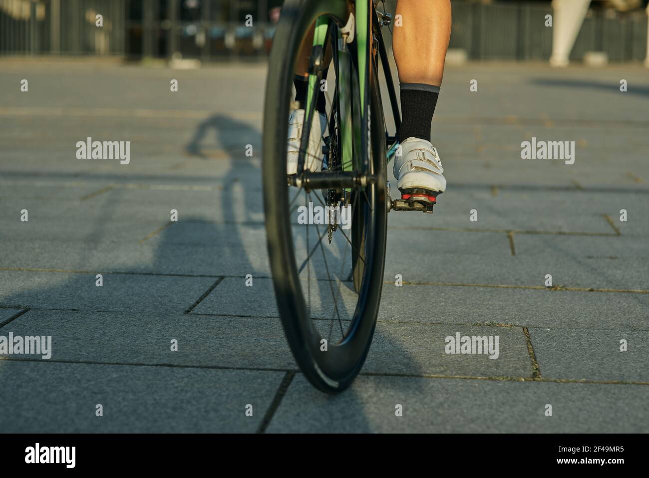 Woman riding bike legs up hi-res stock photography and images - Alamy