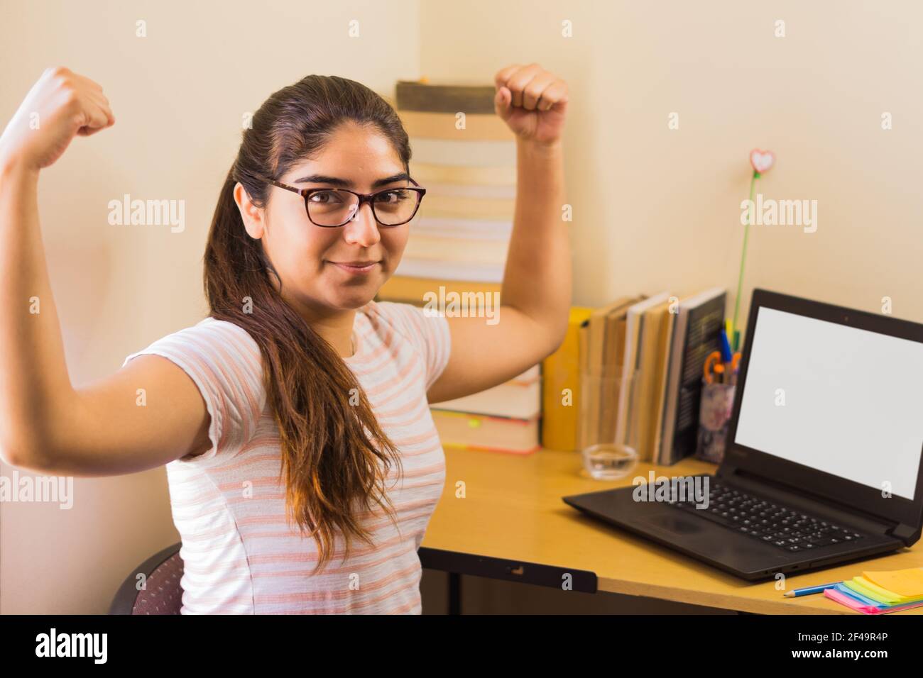 Strong woman demonstrating her muscles hi-res stock photography and ...