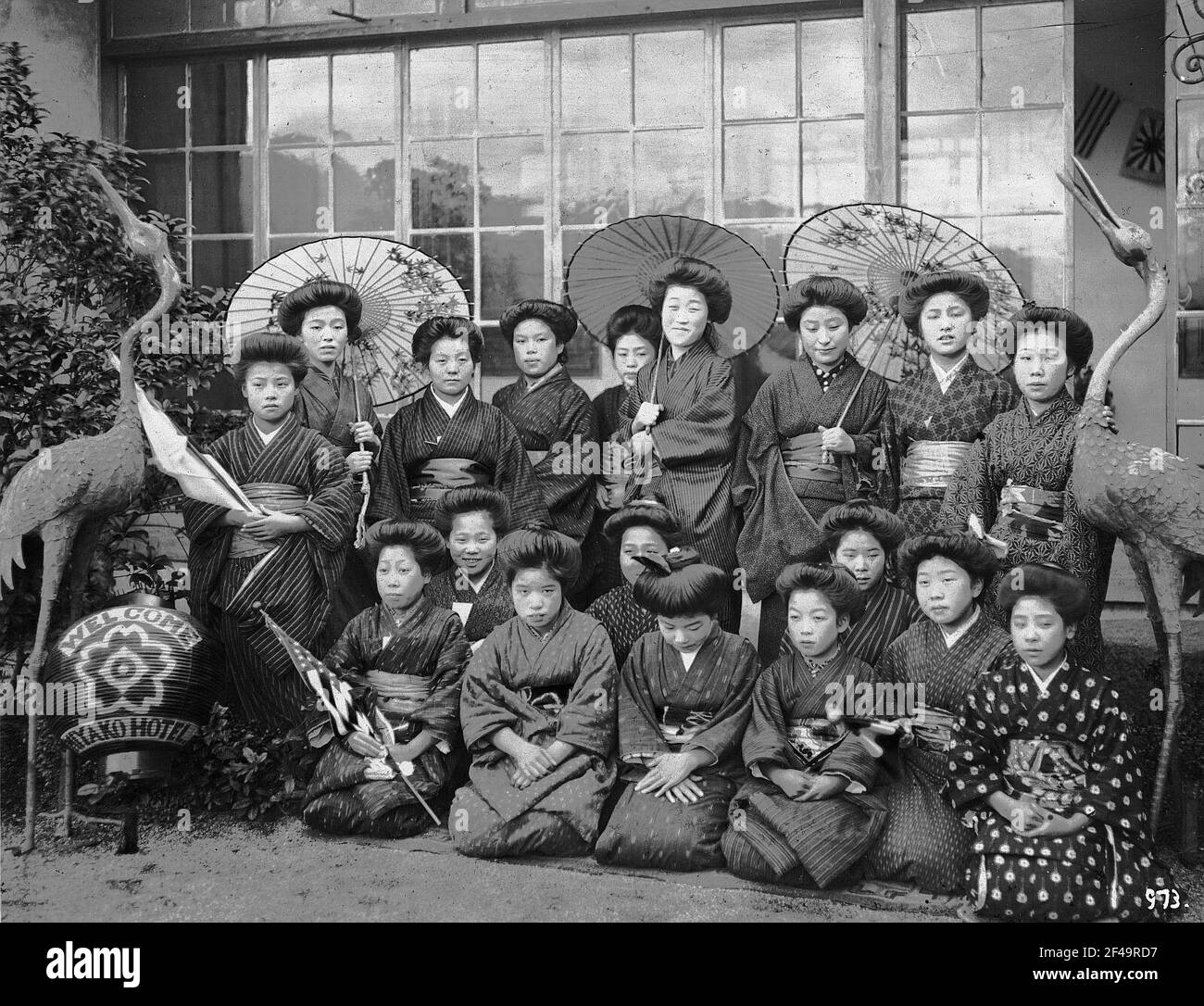 Kyoto, Japan. Group picture with service staff in traditional clothing ...