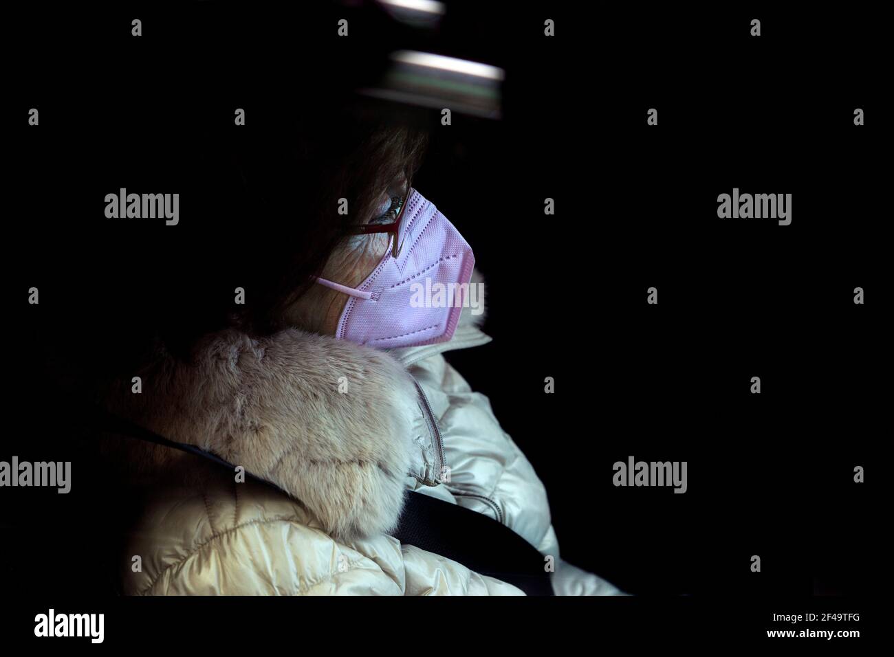 Car passenger wearing face mask Stock Photo - Alamy