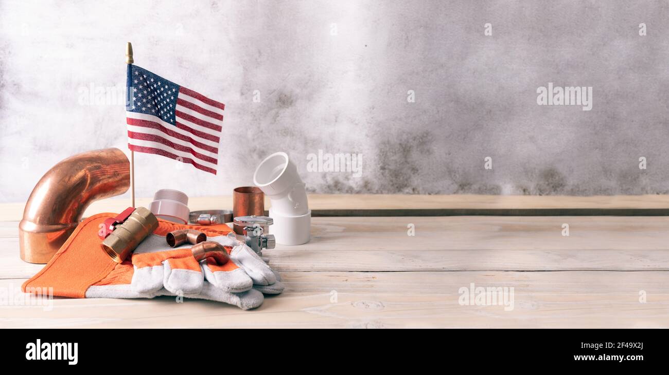Construction and plumber tools with patriotic American flag on old ...