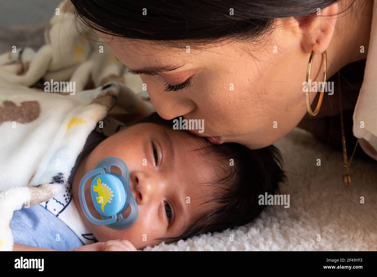 beautiful portrait of a young hispanic mother with her newborn baby ... beautiful portrait of a young hispanic mother with her newborn baby ...