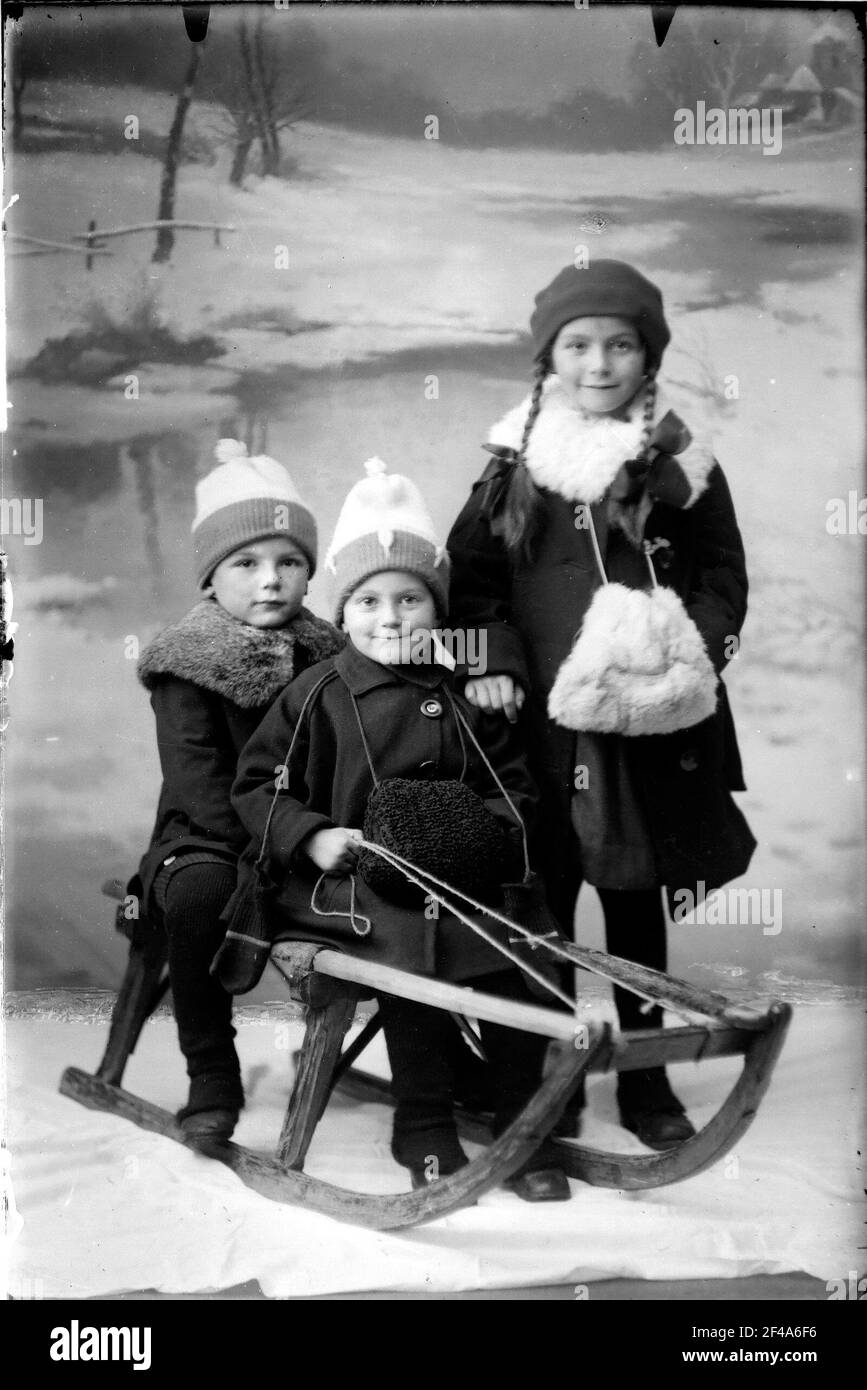 Children with sled Stock Photo - Alamy