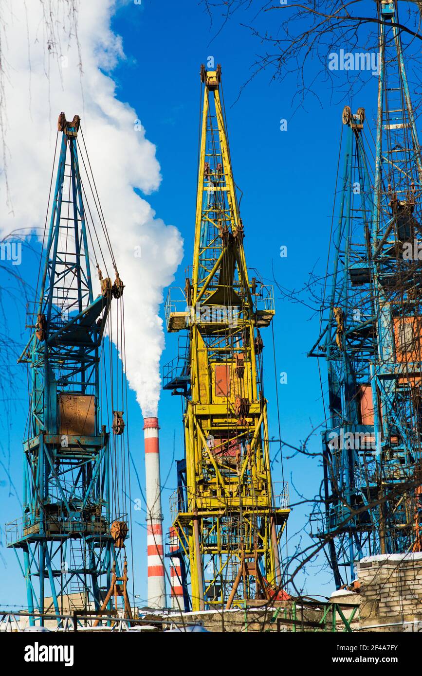 High factory structure and tower crane at industrial production area ...