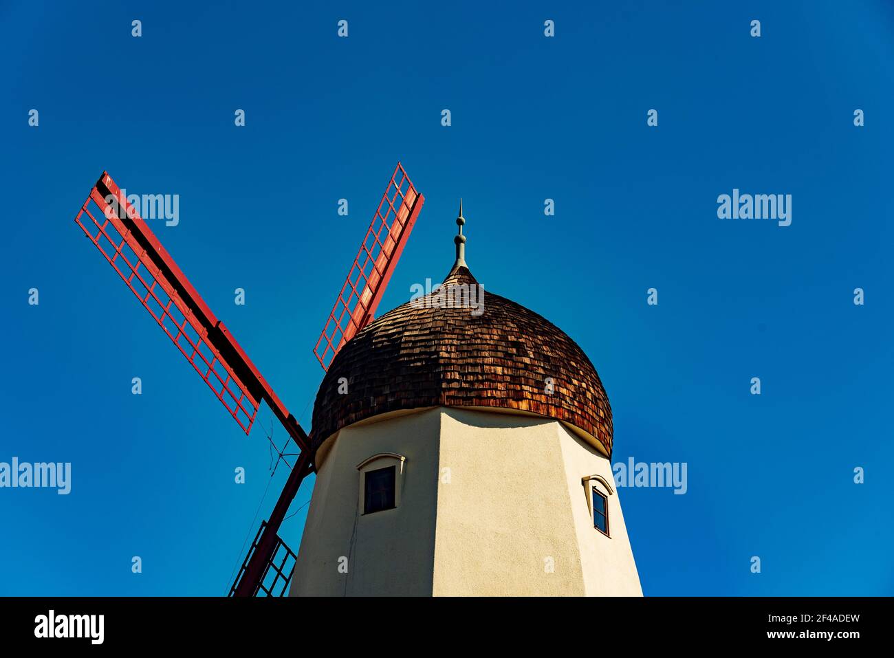 Top of windmill against blue skies Stock Photo - Alamy