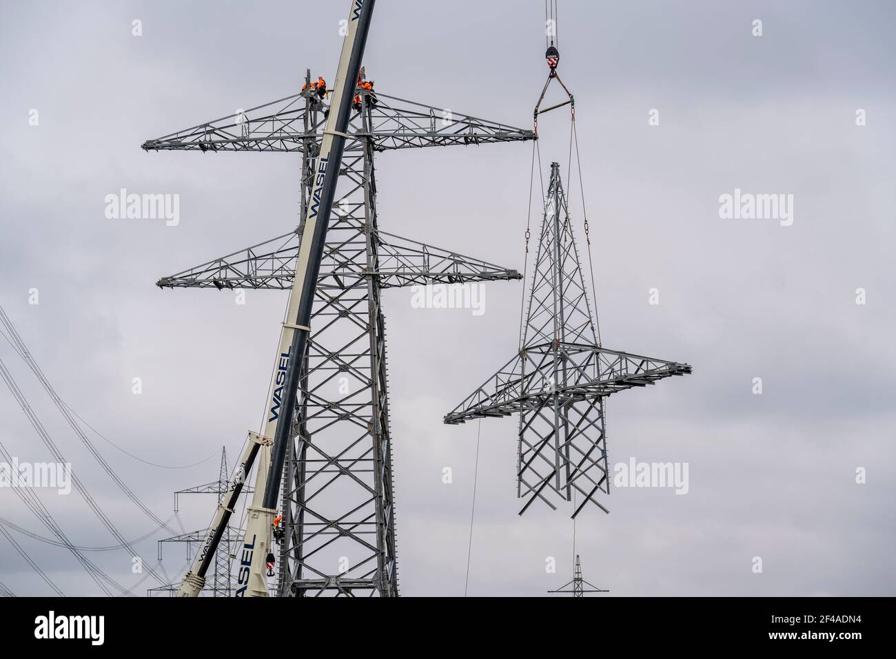 Installation of a high-voltage pylon, construction of a new ...