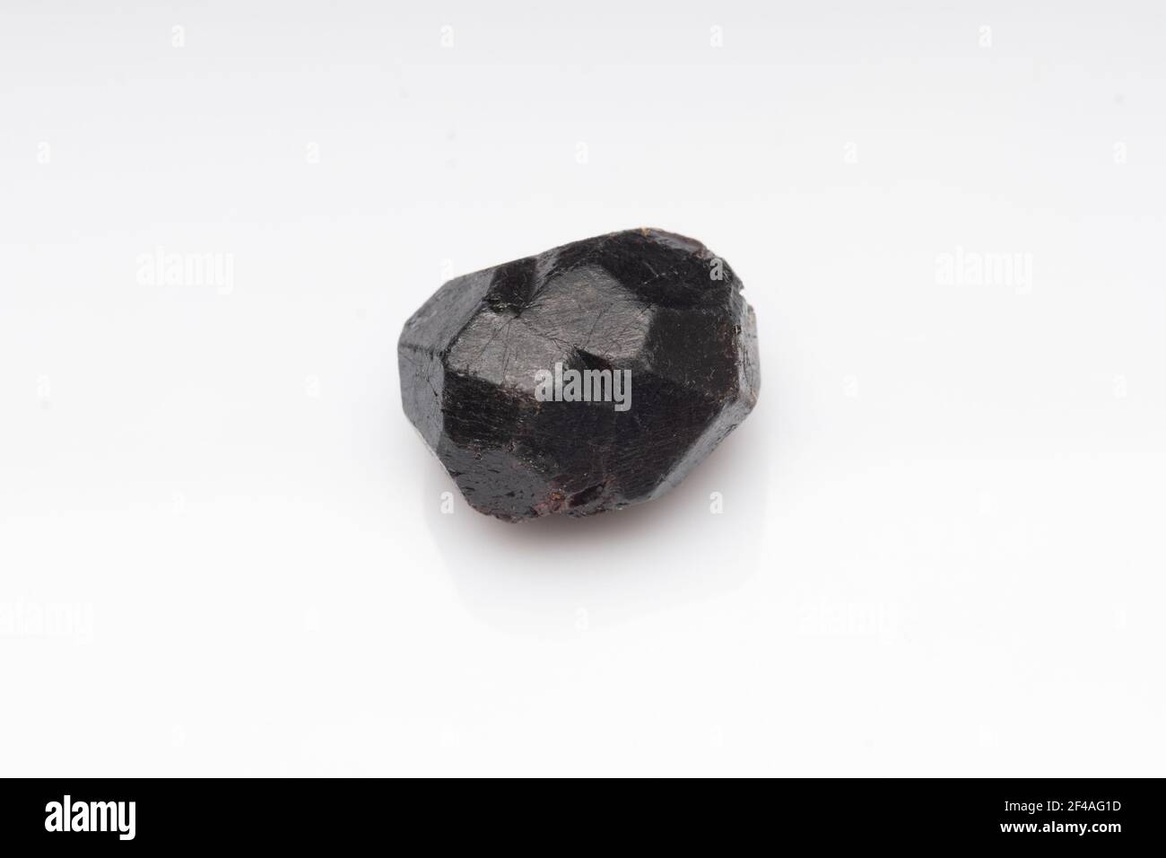 Natural stone garnet on white background Stock Photo - Alamy