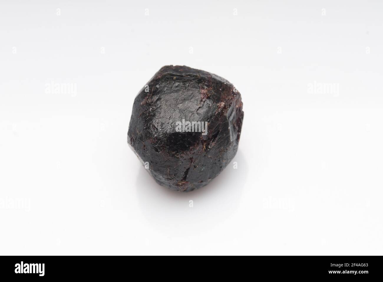 Natural stone garnet on white background Stock Photo - Alamy