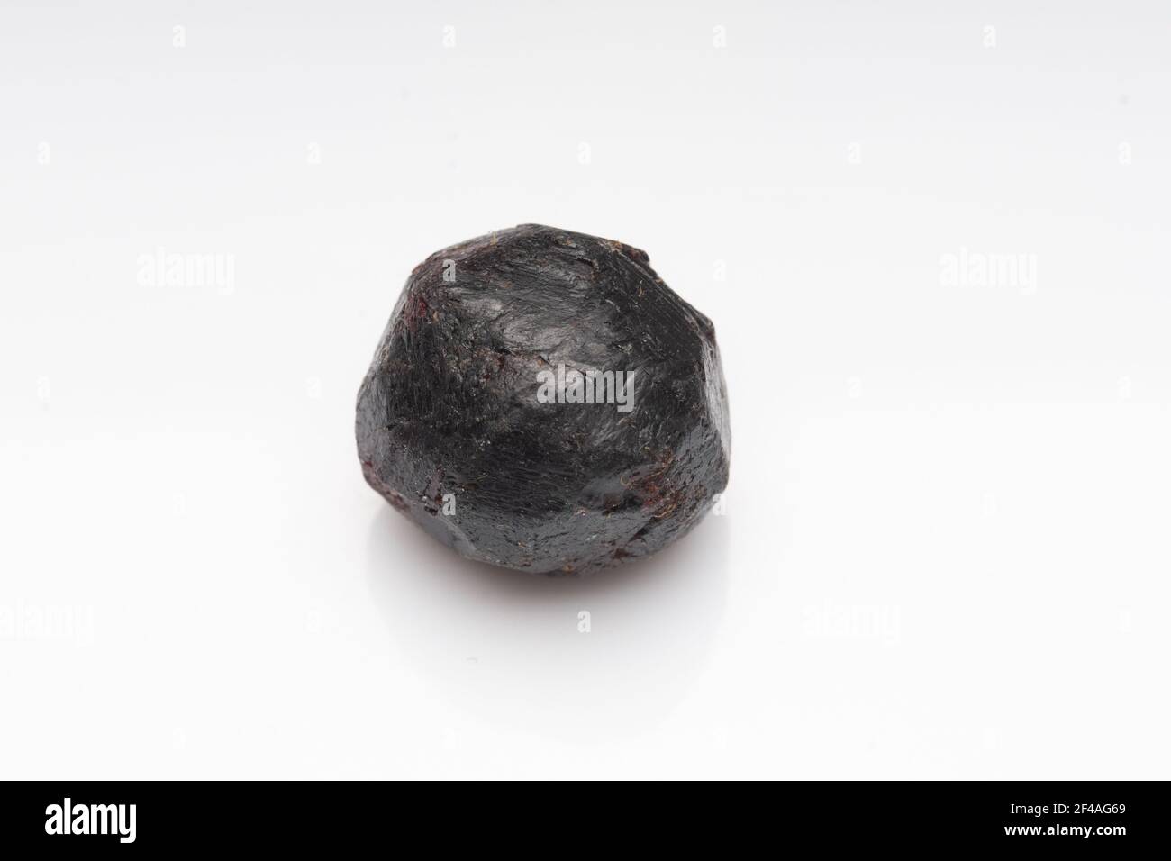 Natural stone garnet on white background Stock Photo - Alamy