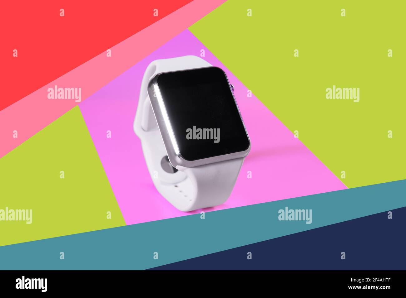 Modern smart watch on color background Stock Photo - Alamy