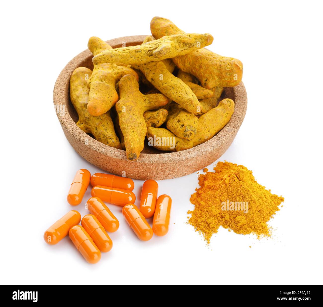 Turmeric pills and bowl with roots on white background Stock Photo - Alamy