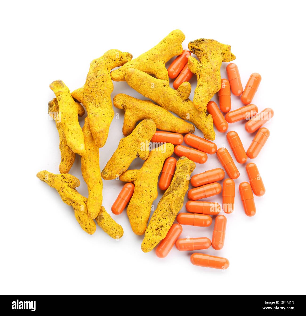 Turmeric pills and roots on white background Stock Photo - Alamy