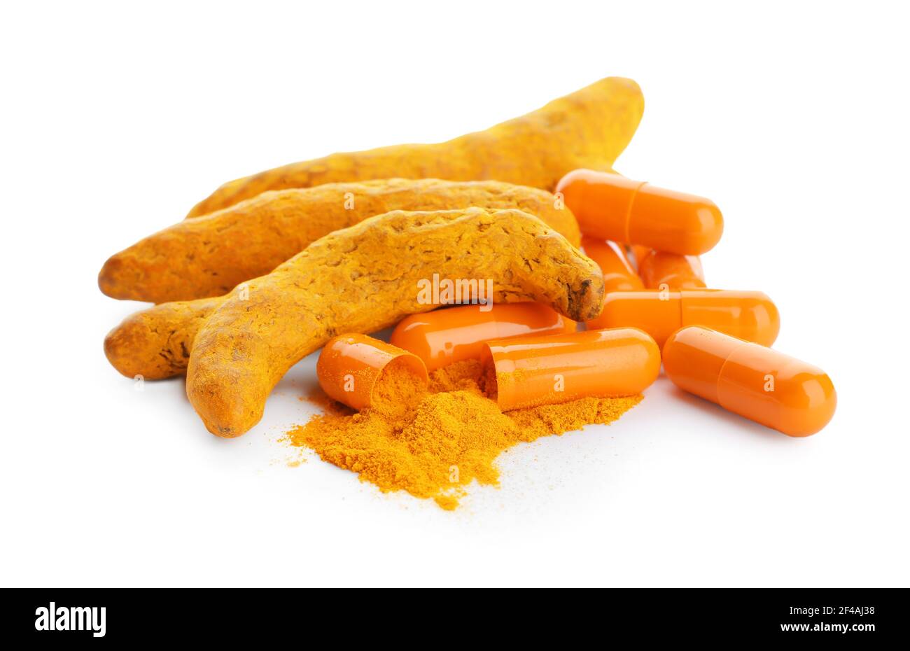 Turmeric pills and roots on white background Stock Photo - Alamy