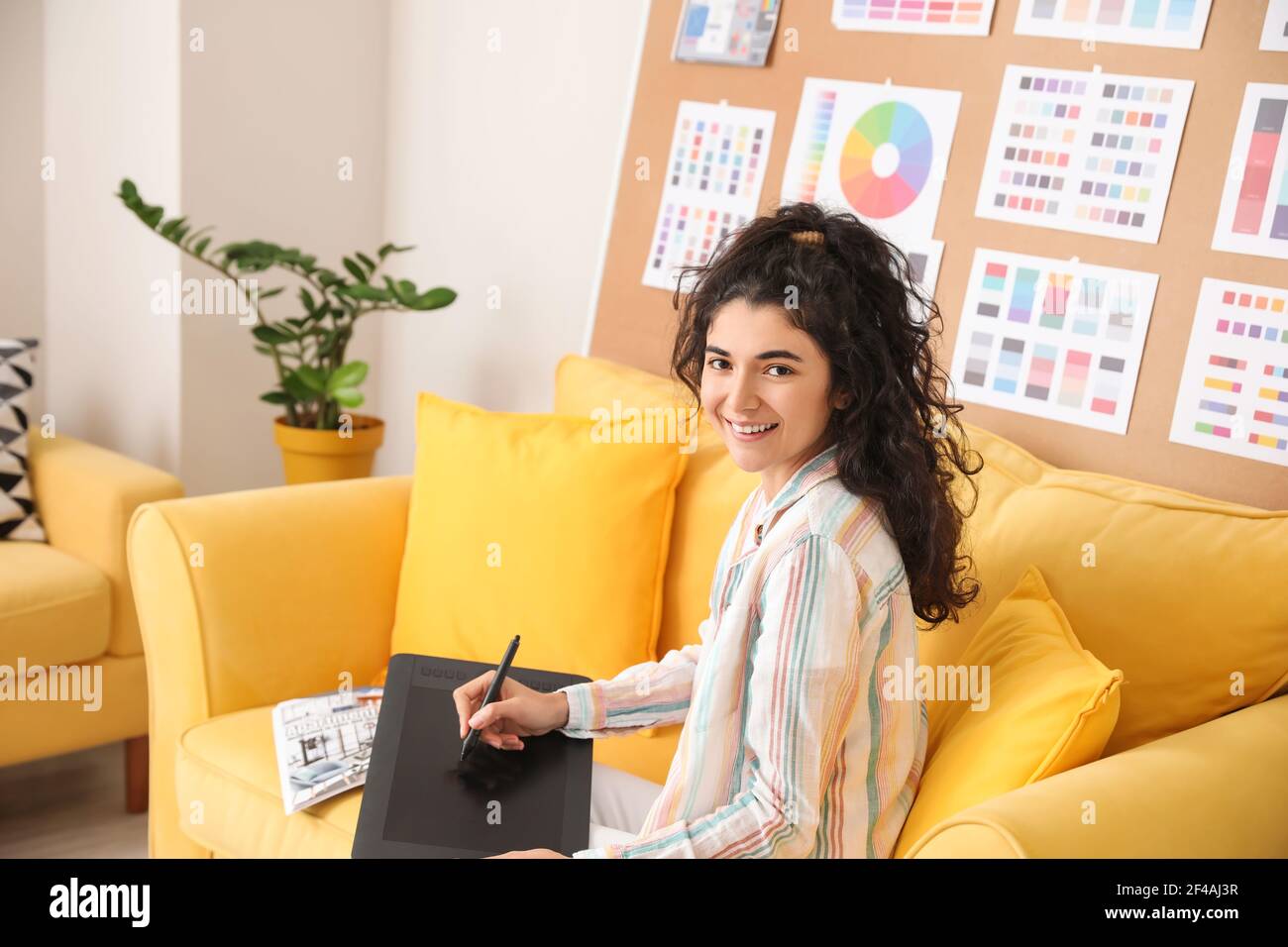 Graphic designer working in office Stock Photo - Alamy