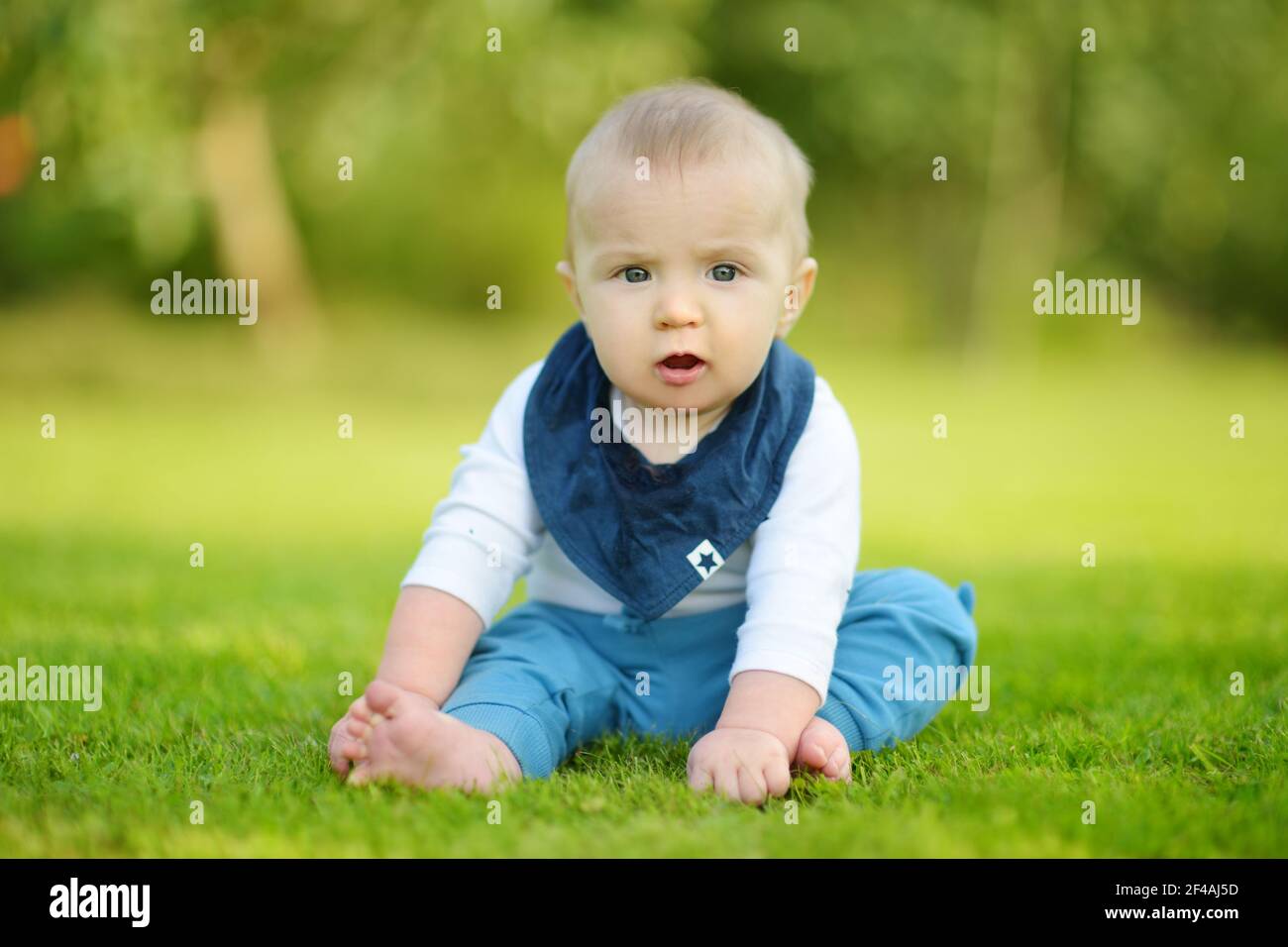Cute five months old baby boy learning how to sit up without support ...