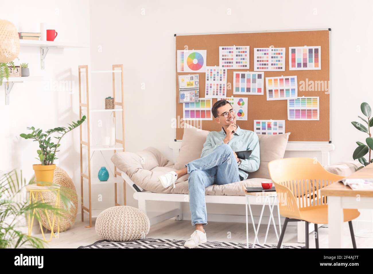 Graphic designer working in office Stock Photo - Alamy