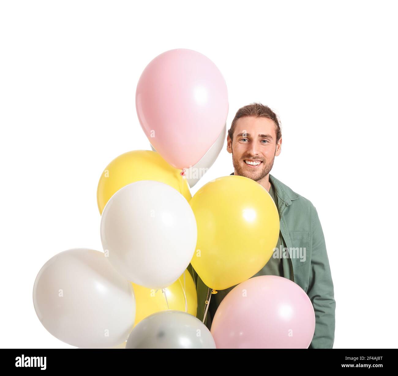 Handsome young man with balloons on white background Stock Photo - Alamy