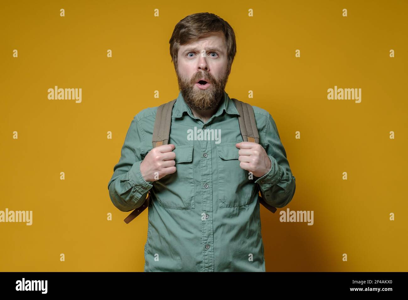 Surprised, scared man with a backpack urban anxiously looking at the ...