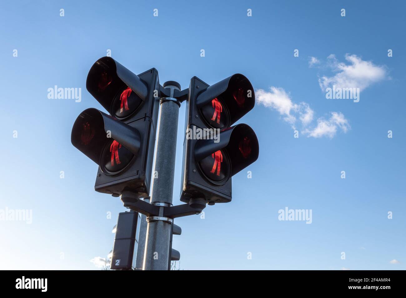 Low angle view, traffic light with red human symbol to stop walking ...