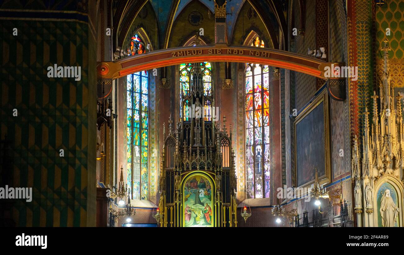 Apse with High altar in Gothic style and stained glass in Art Nouveau ...