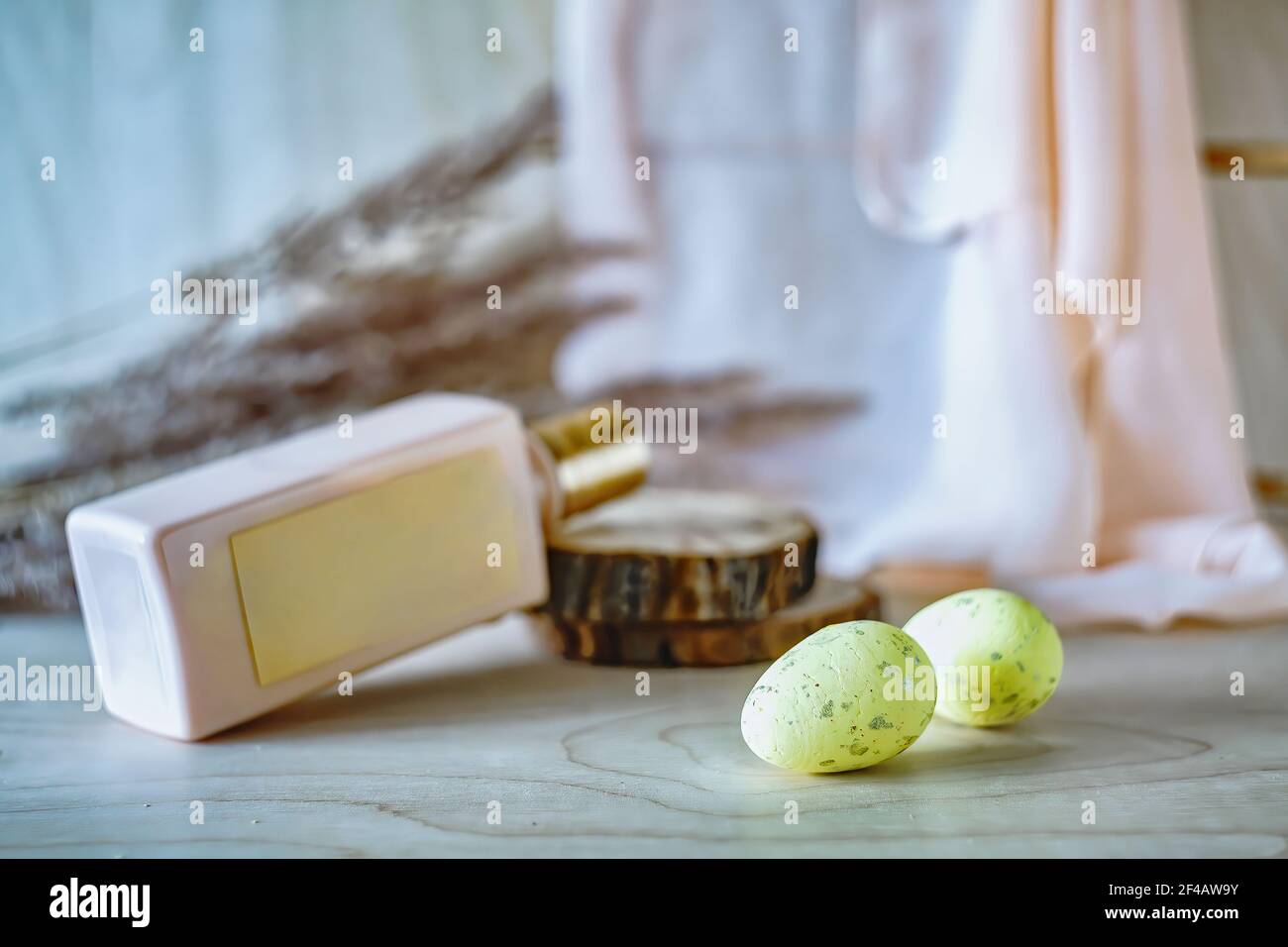 Composition with Easter eggs and body lotion Stock Photo - Alamy