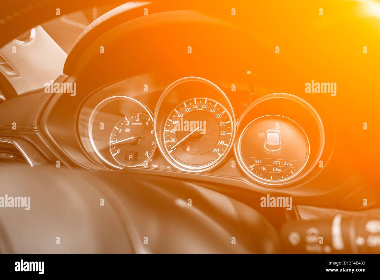 dashboard of the car is illuminated by bright illumination. Speedometer ...
