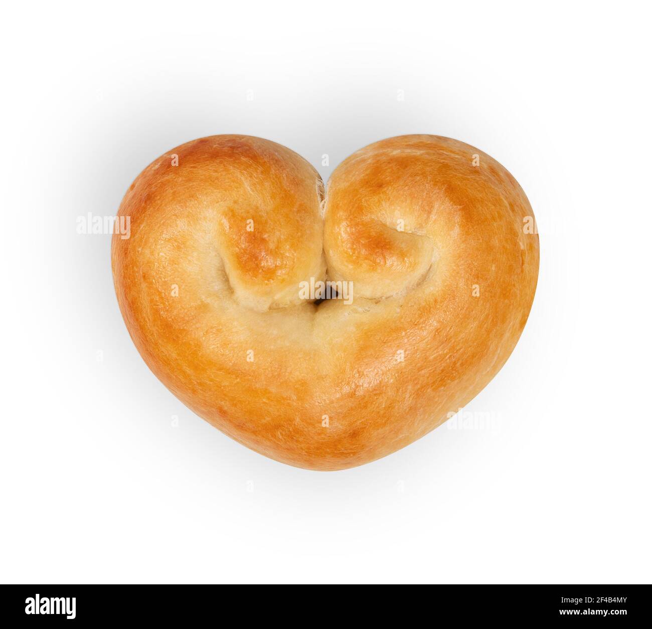 Romantic bread heart. Yeast bread bun in heart shape with egg wash ...