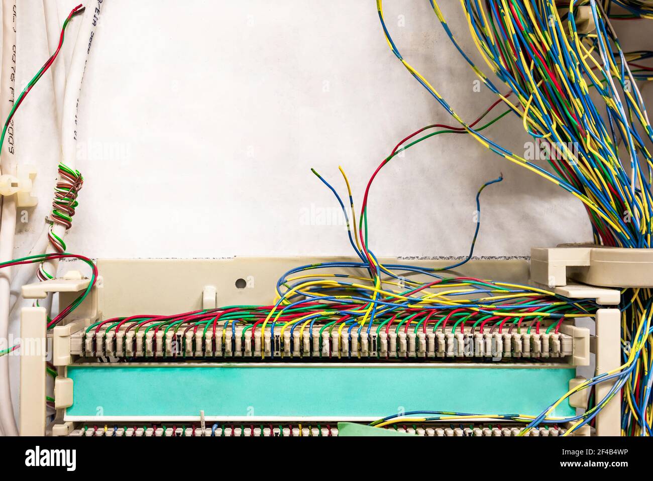 Demarc rack, close up. Punch-down block or BIX wafer. Red, blue and ...