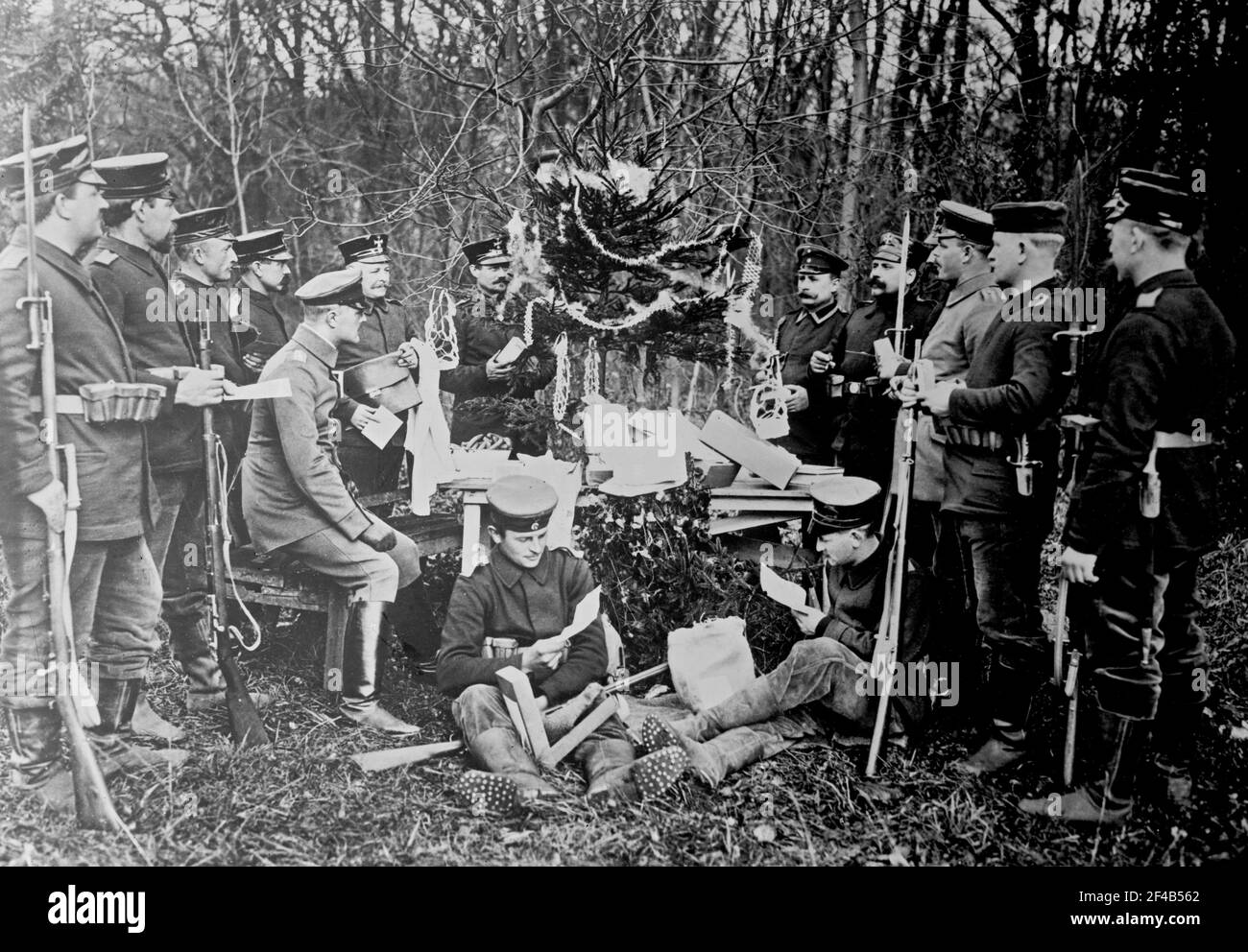 German soldiers gathered around a Christmas tree, outside during World ...