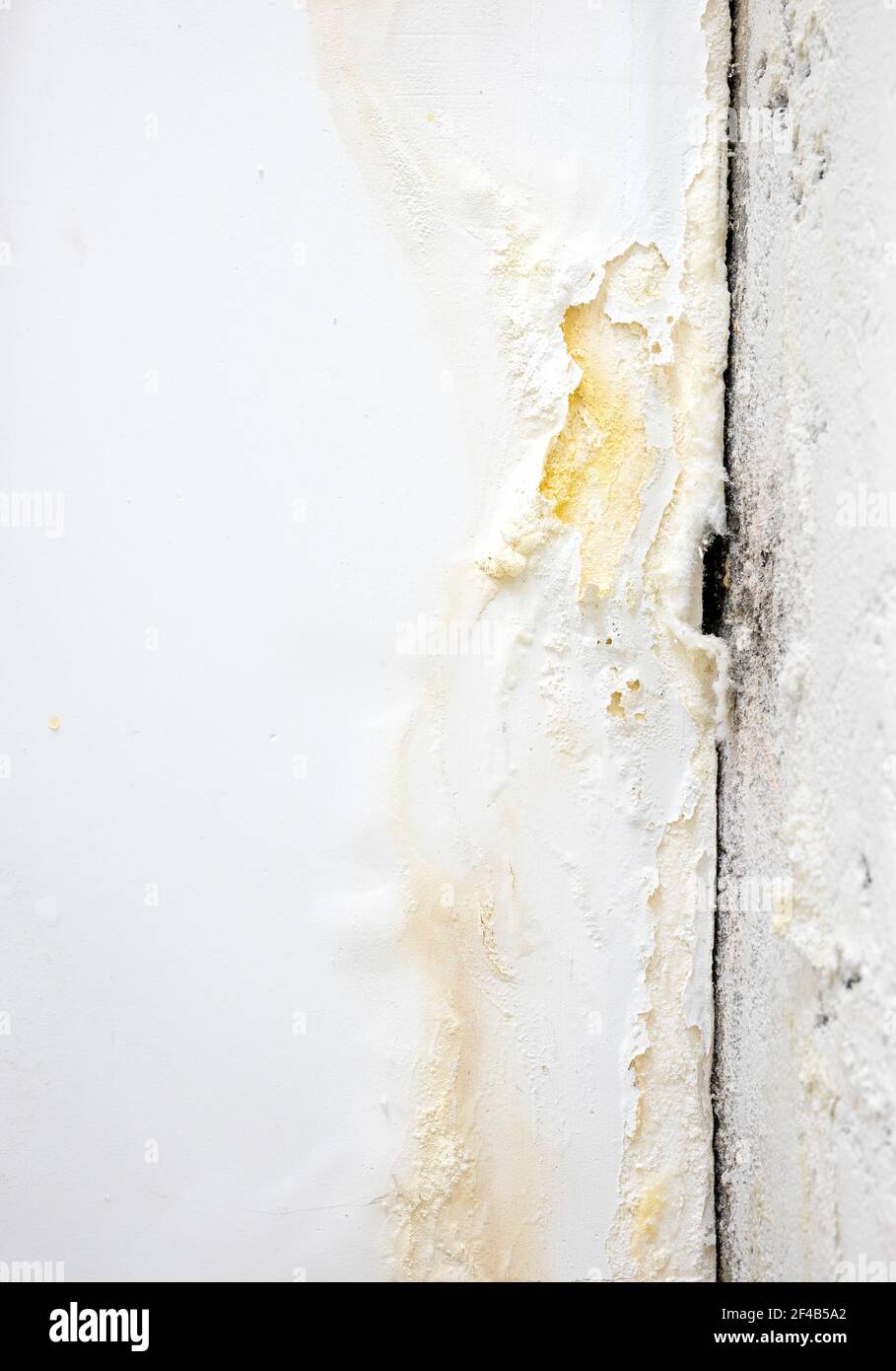 Drywall water damage. Close up of white plaster board wall section ...