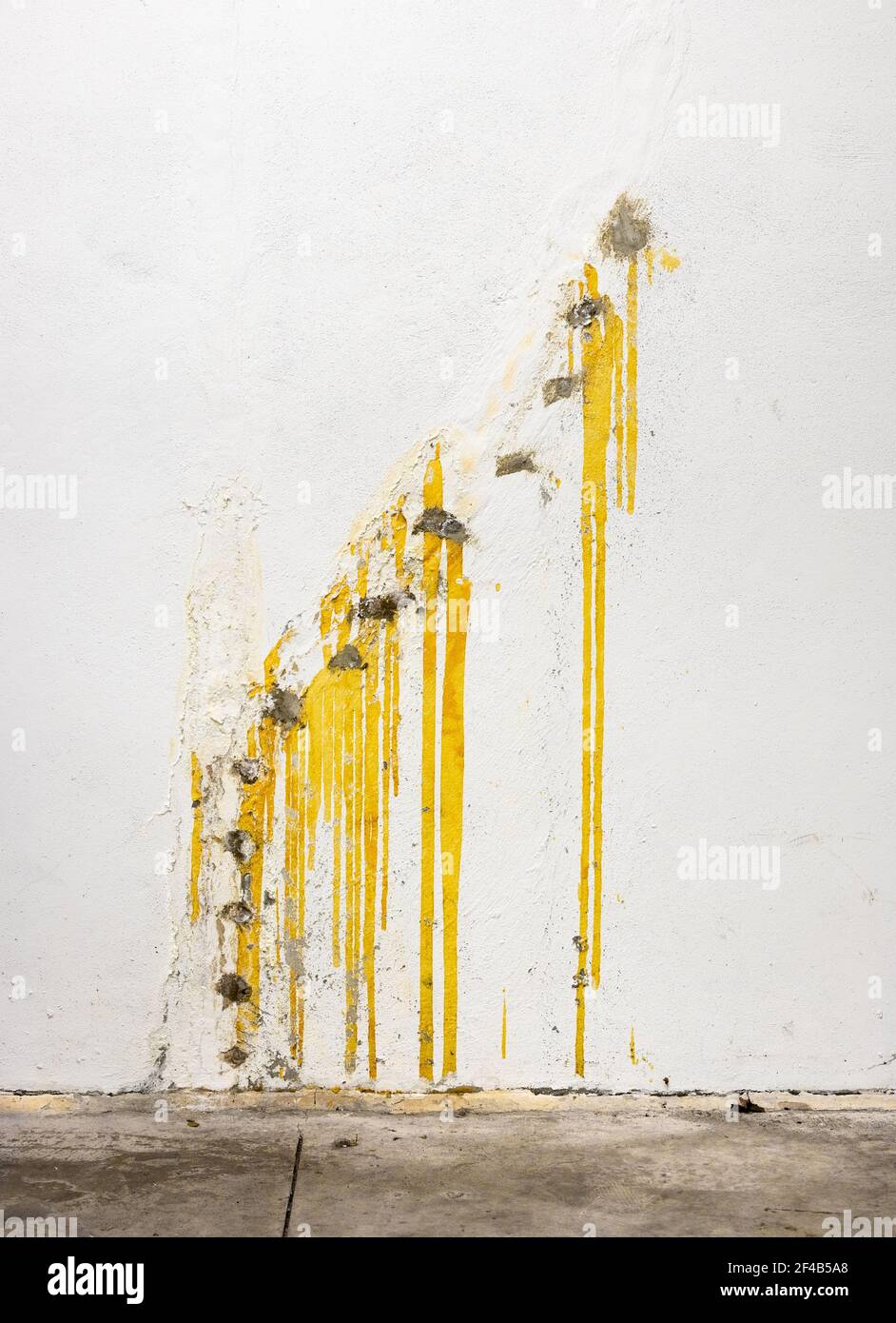 Multiple diagonal yellow epoxy injections to repair or stop water leaks ...