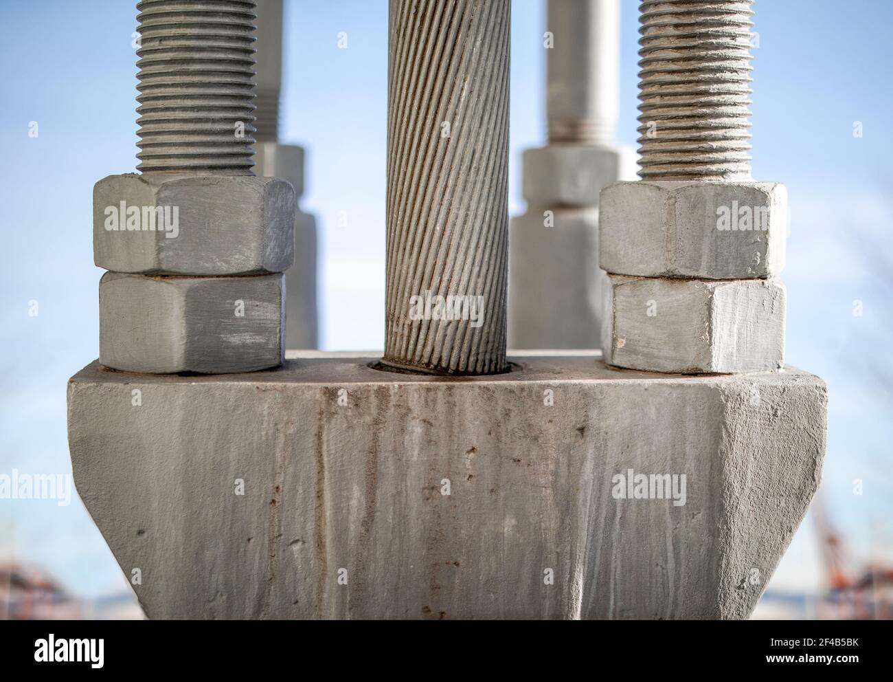 Massive threated cables with large nuts, early mornings with blue sky ...
