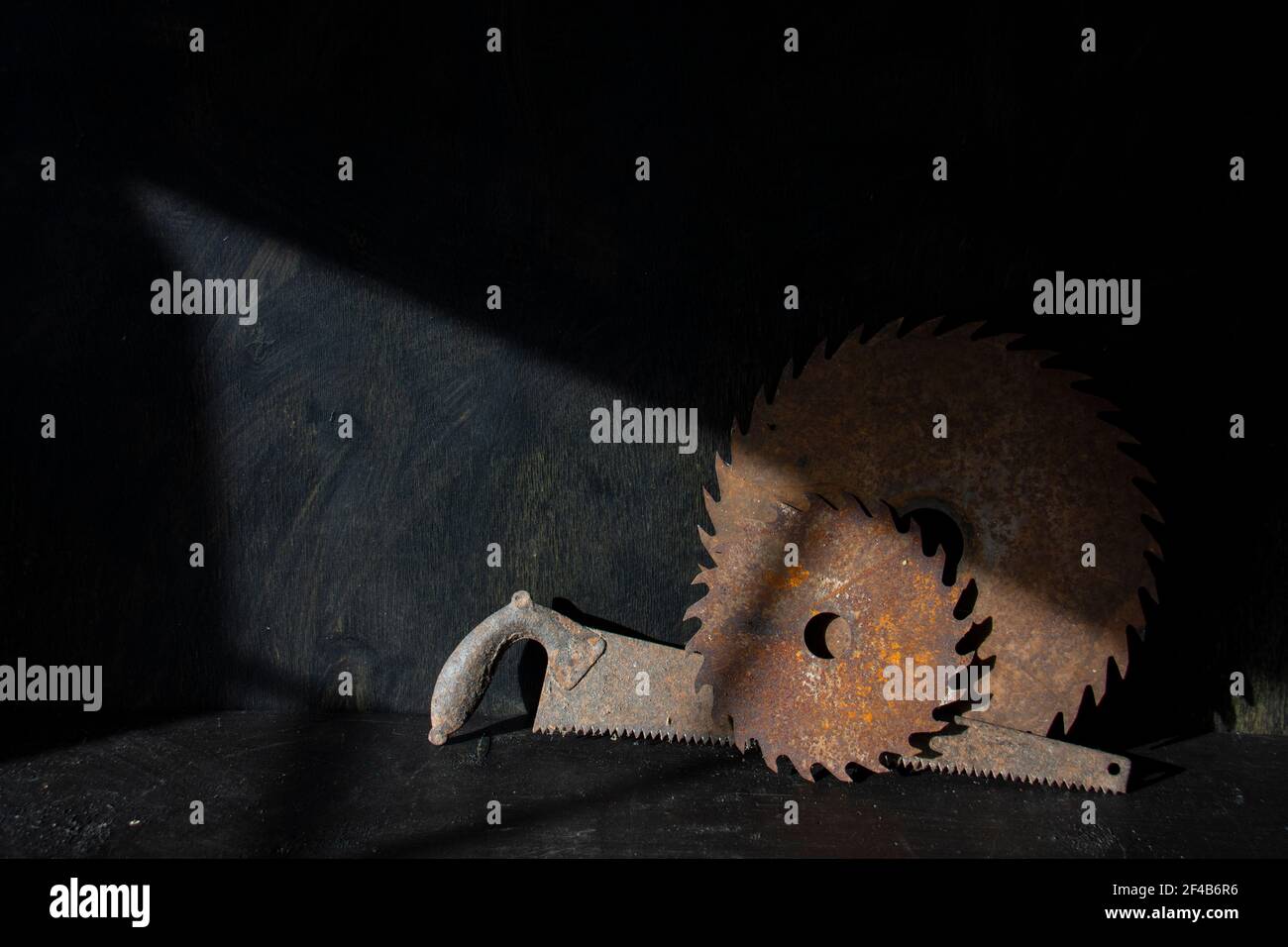 Still life with rusty circular and hand saw Stock Photo - Alamy