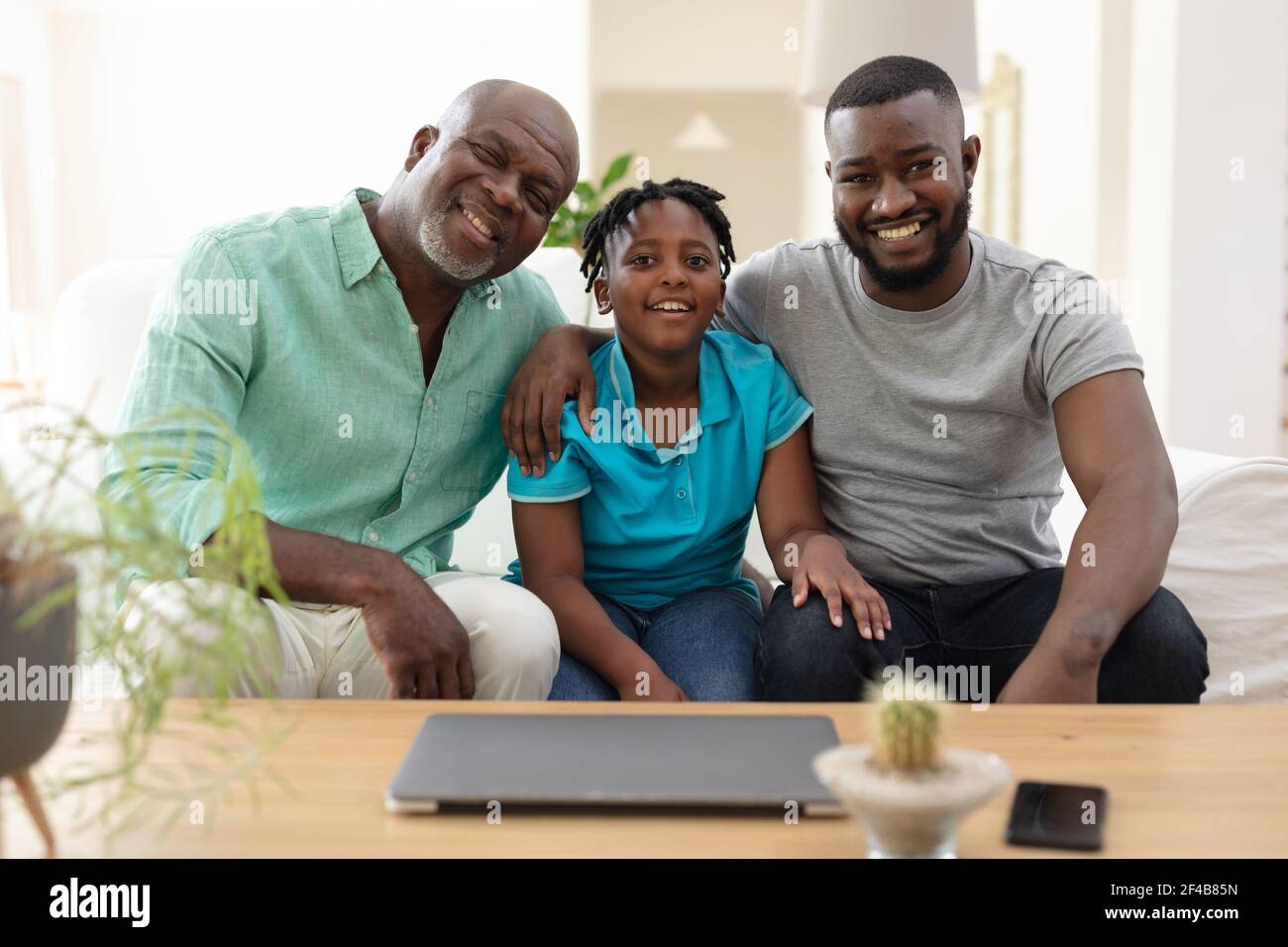 Portrait of senior african american grandfather with adult son and ...