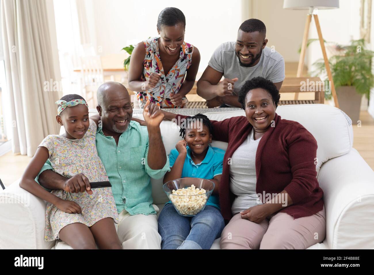 Excited african american parents, grandparents and grandchildren on ...